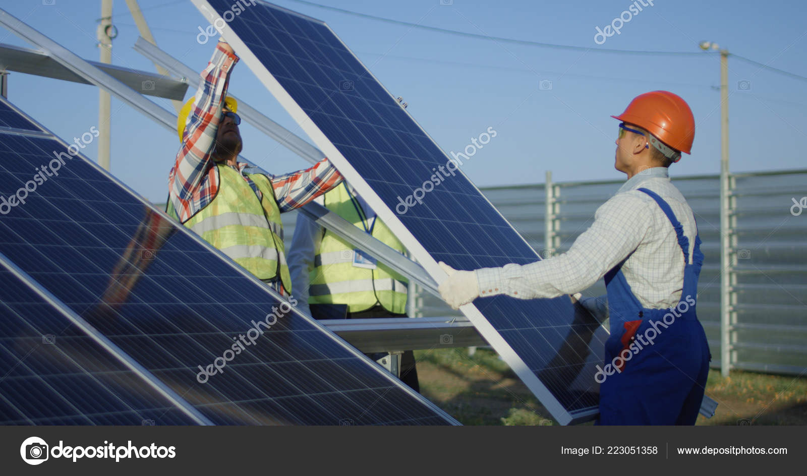 Two workers install a solar panel Stock Photo by ©EvgeniyShkolenko ...