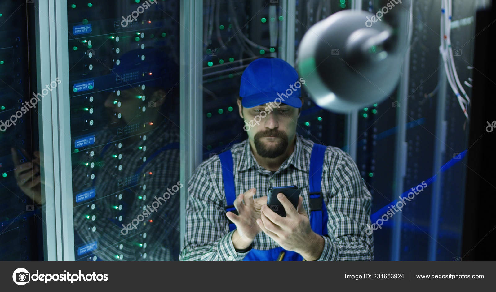 Technician checking camera at a data center — Stock Photo ...
