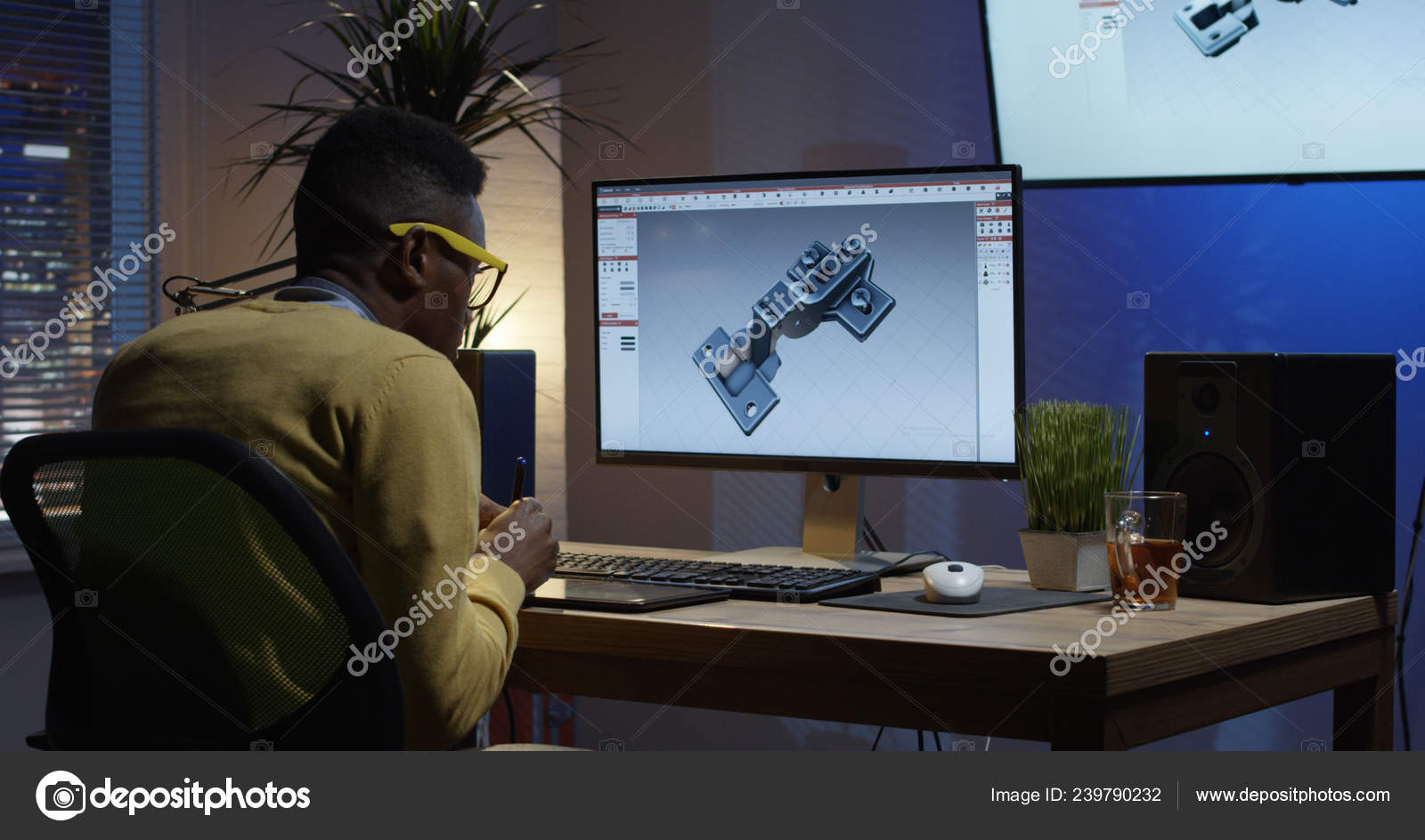 Young man sitting back and editing an 3D model on his computer — Stock ...