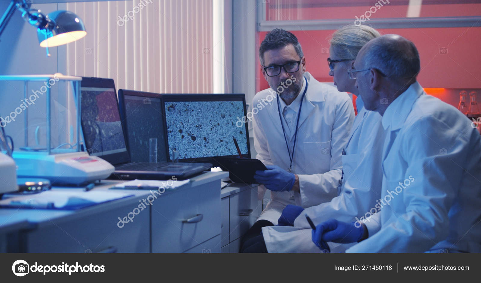 Scientists watching monitor and analyzing Stock Photo by ...