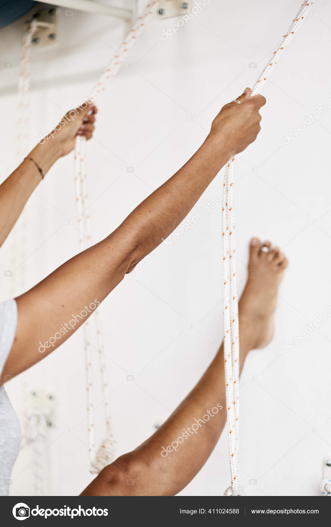 Woman Practicing Iyengar Yoga Using Wall Ropes Studio Supta ...