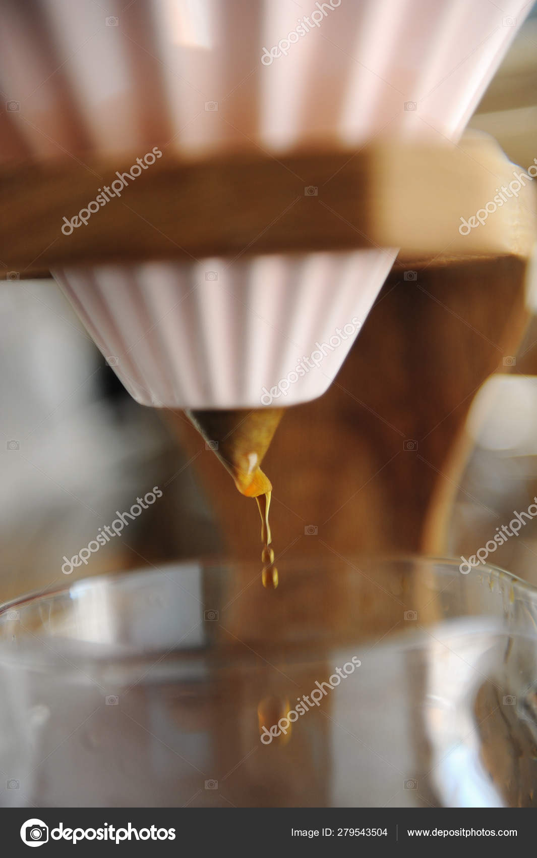 Close up coffee dripping. Alternative brewing in pink ceramic origami ...