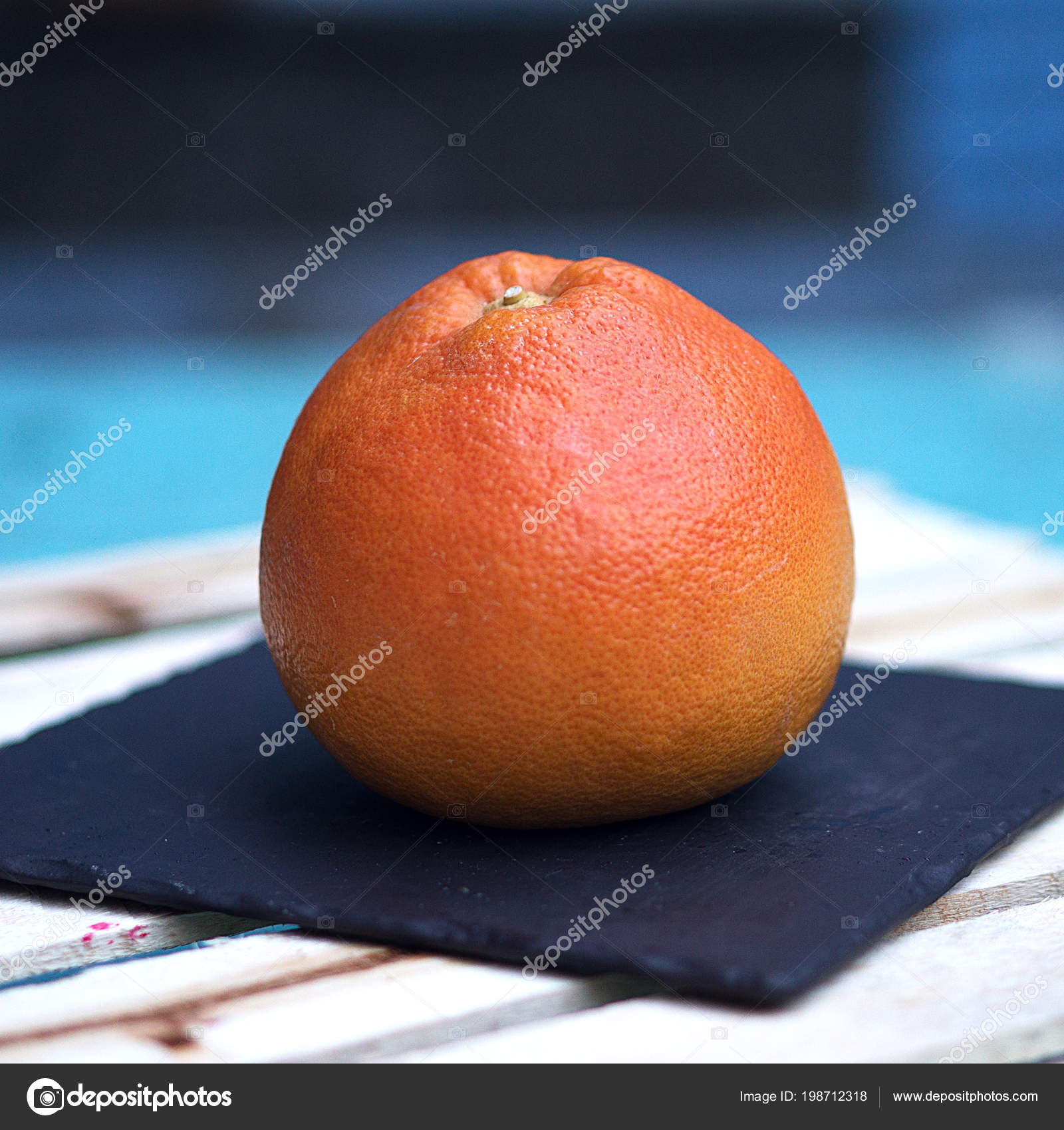 Red Pomelo Table Blue Background Stock Photo by ©Marina.Izosimova 198712318
