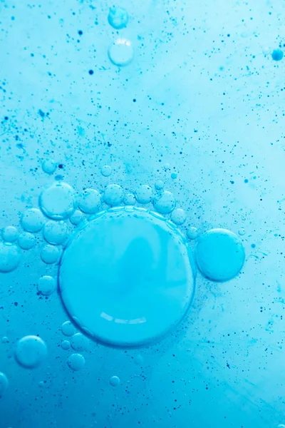 Abstract purity transparent liquid blue bubbles background, vertical ...