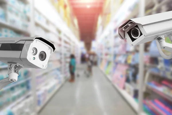 CCTV Security camera shopping department store on background. - Stock ...