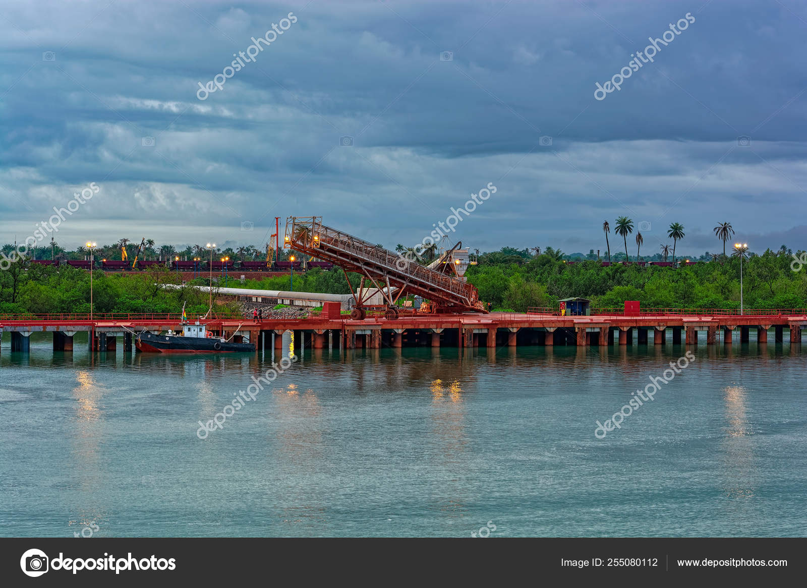 Outdoor industrial jetty at river bank with incline large convey ...