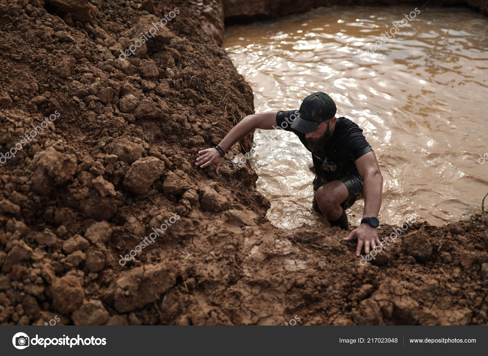 Strong Man Climbing Mud Hill Dirty Wet Black Sportwear Accessories ...