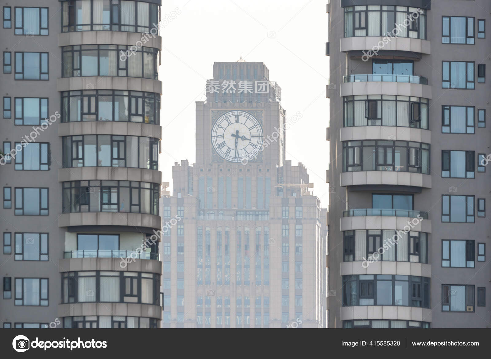 Global Times Center clock tower behind residential buildings in Chengdu ...