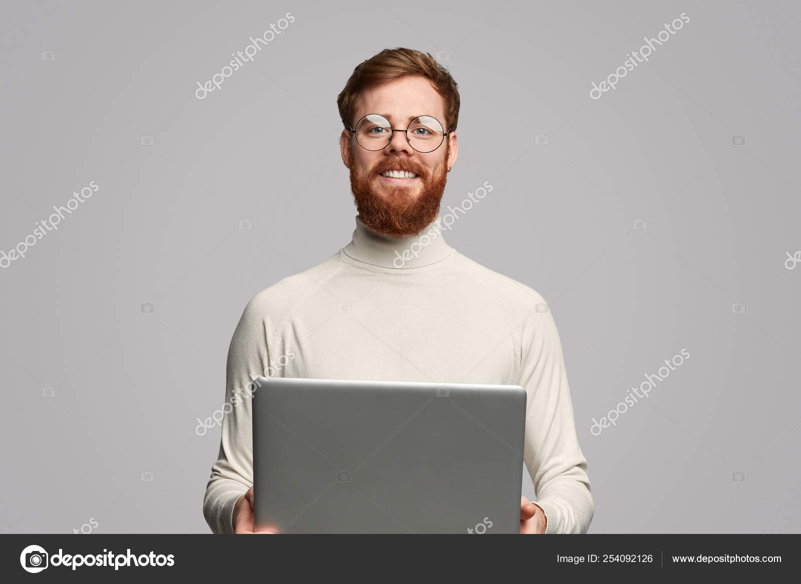 Cheerful programmer with laptop Stock Photo by ©kegfire 254092126