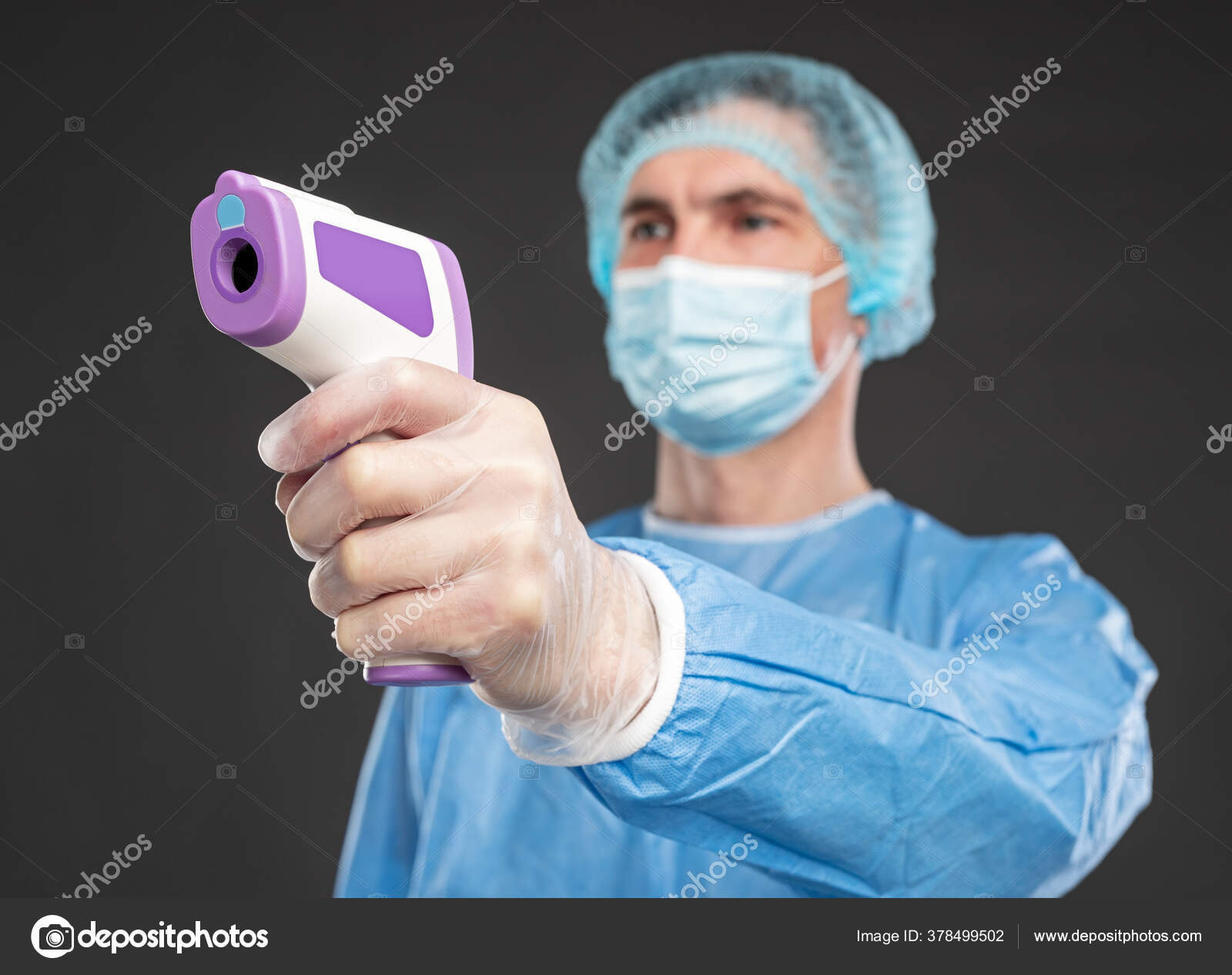 Doctor with contactless infrared thermometer — Stock Photo © kegfire ...