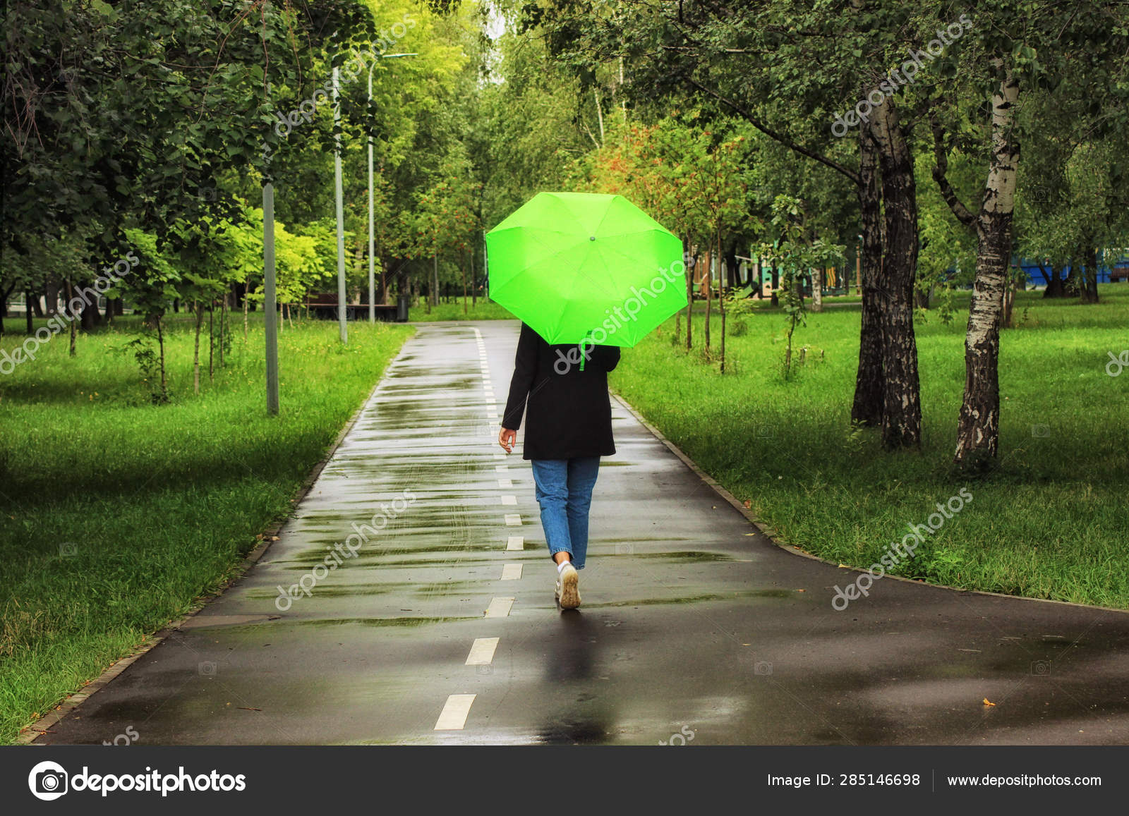 Lonely Girl In Rain With Umbrella
