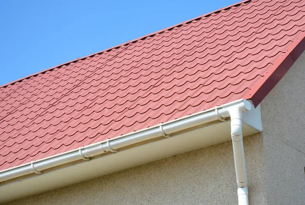 Red metal roof tiles. Metal Roof Shingles - Roofing Construction ...