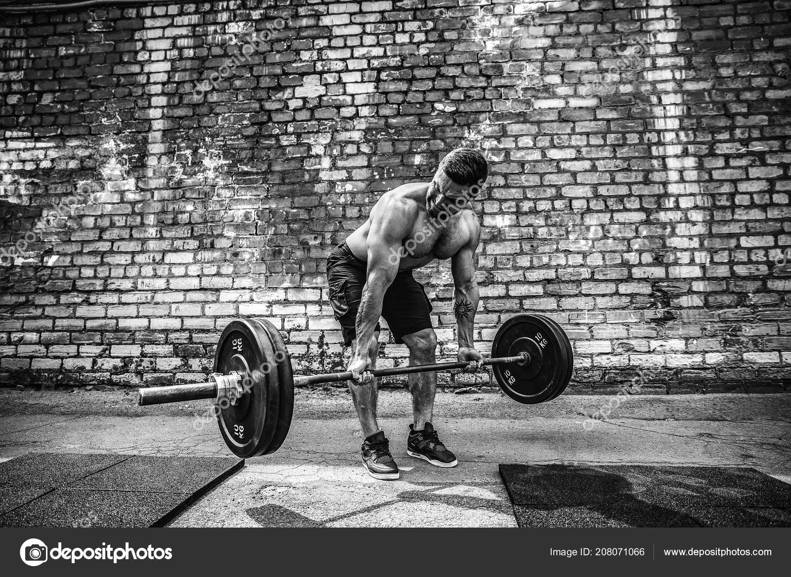 Athletic man working out with a barbell. Strength and motivation ...