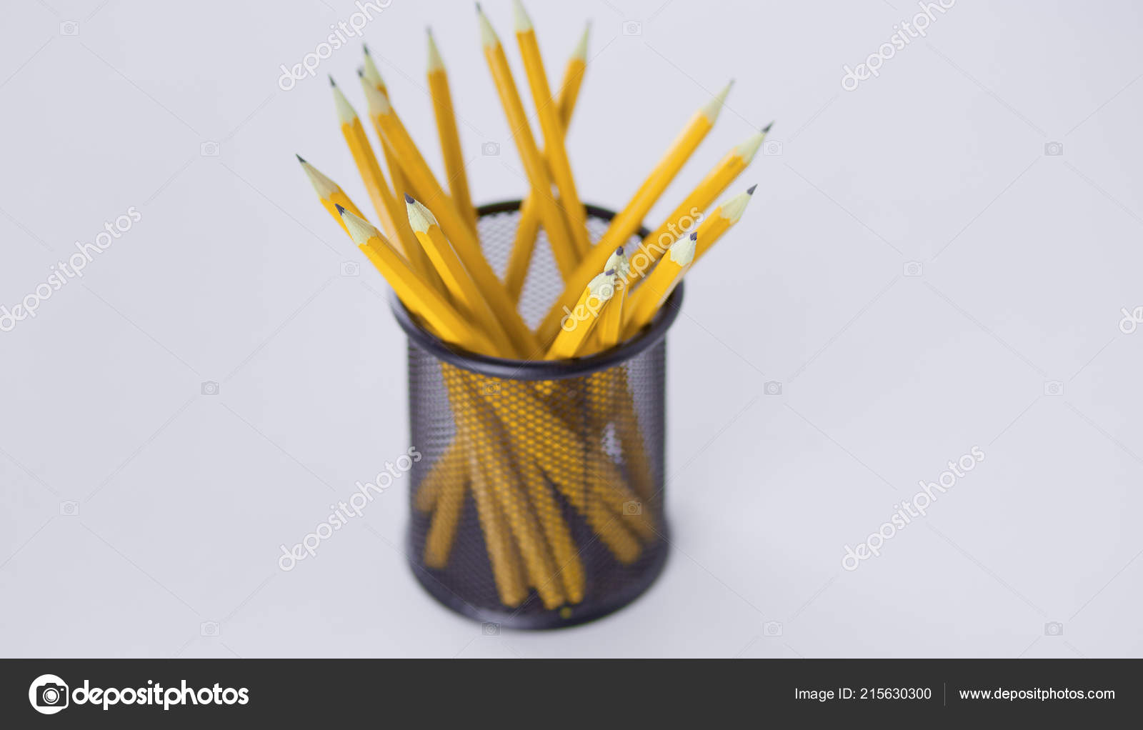 Graphite pencils in a metal grid-container. Concept Stock Photo by ...