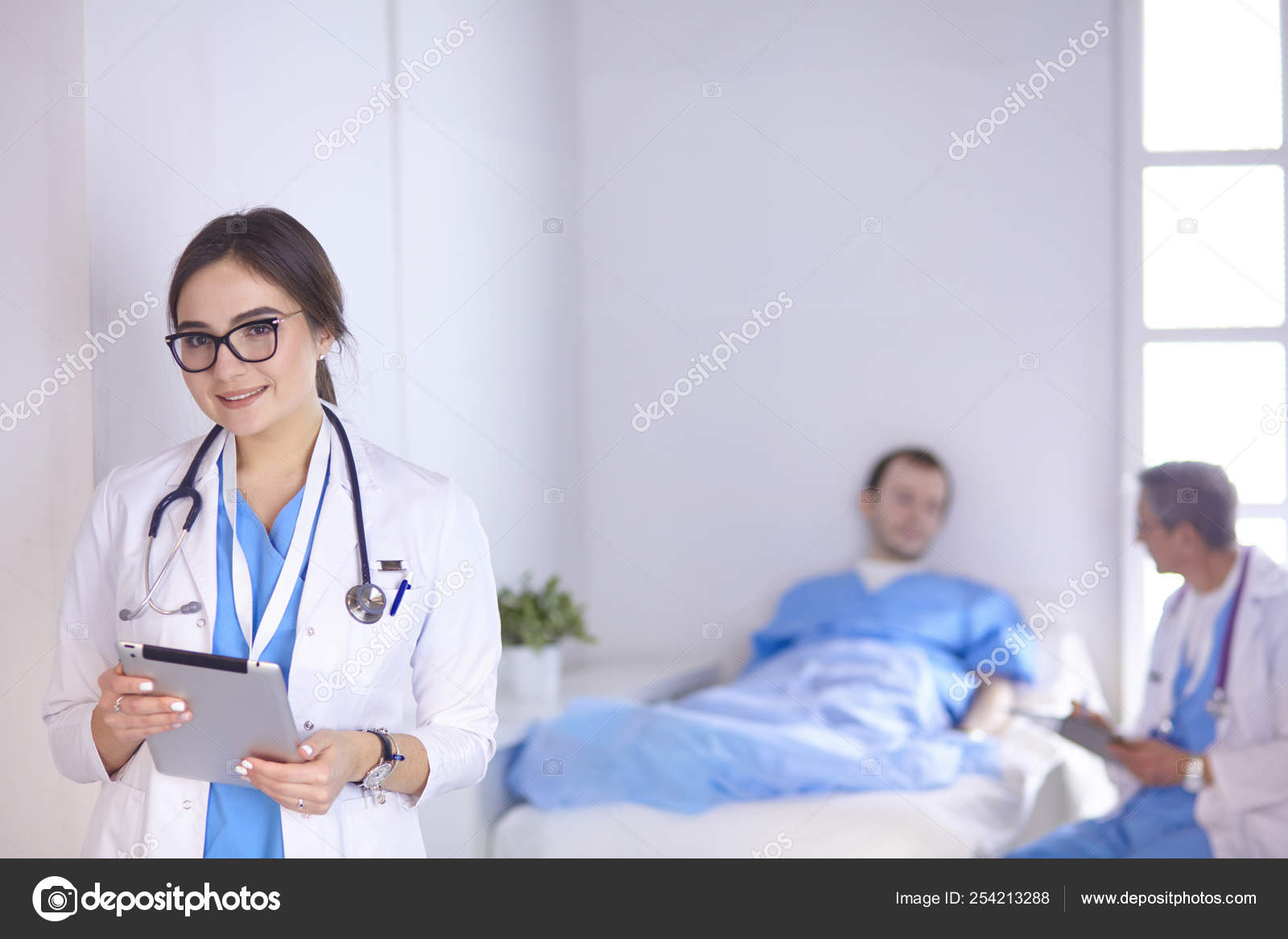 Doctor checking heart beat of patient in bed with stethoscope Stock ...
