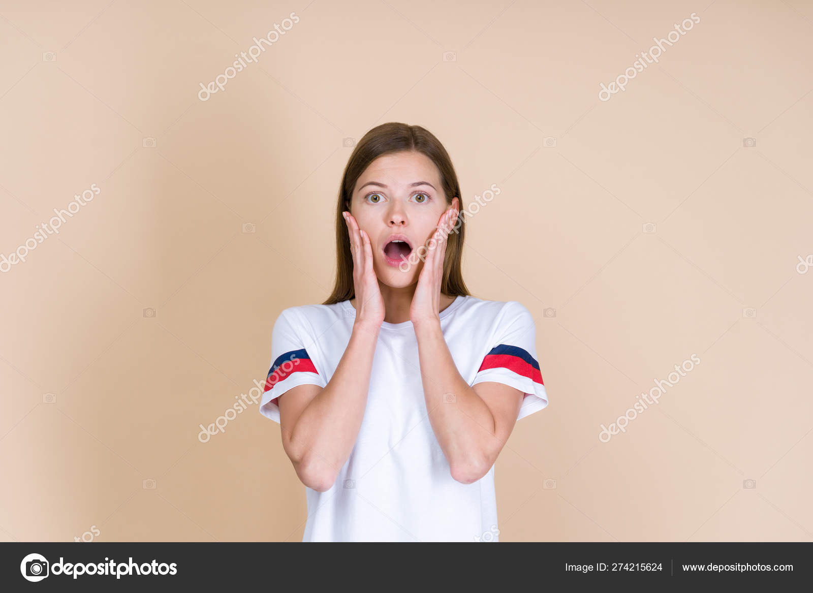 Front view of shocking young adult woman looking at camera and m Stock ...