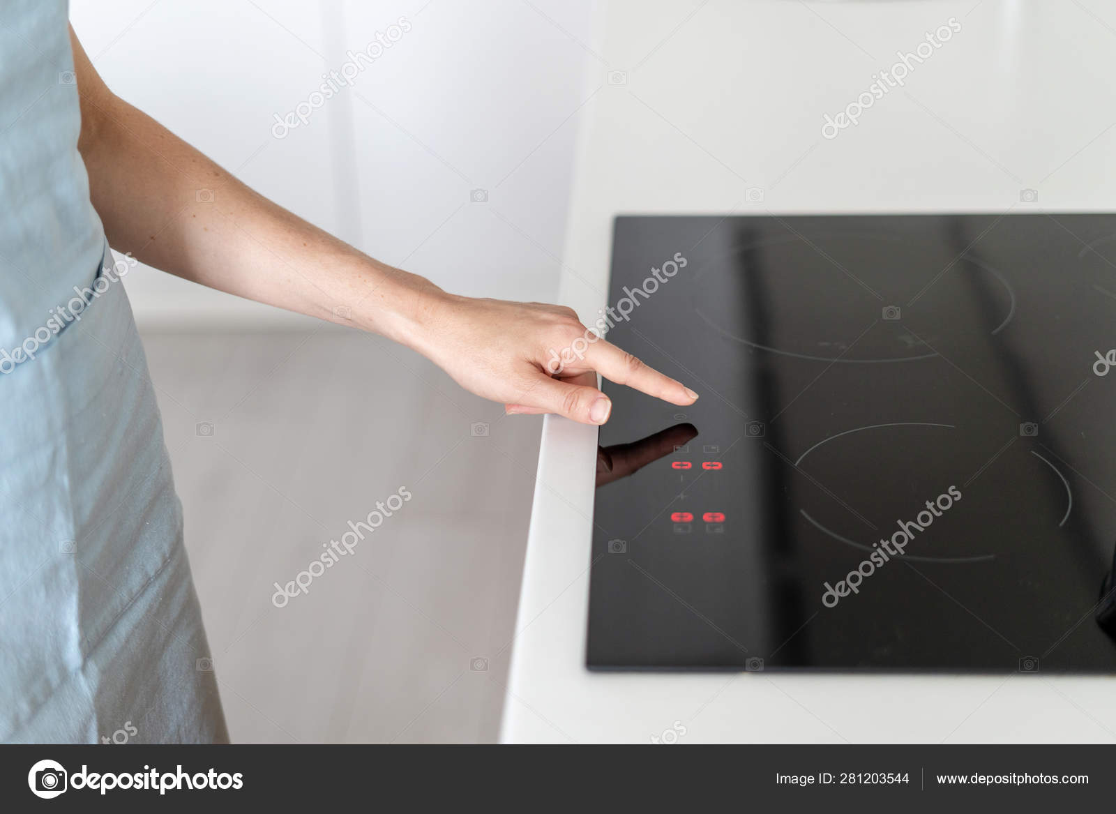 Woman using built in stove, selecting program on display Stock Photo by ...
