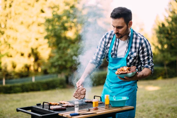 Man grilling Stock Photos, Royalty Free Man grilling Images | Depositphotos