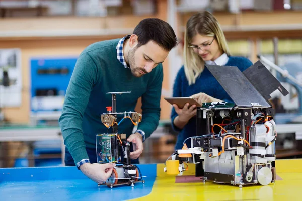 Engineering students working in the lab Stock Photo by ©stockasso 96585664