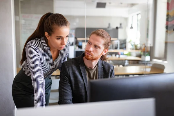 Programmers cooperating working at information technology company ...