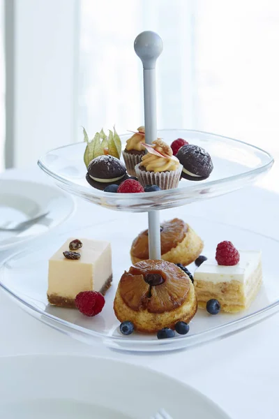 Petit four stand Stock Photos & Royalty-Free Images | Depositphotos