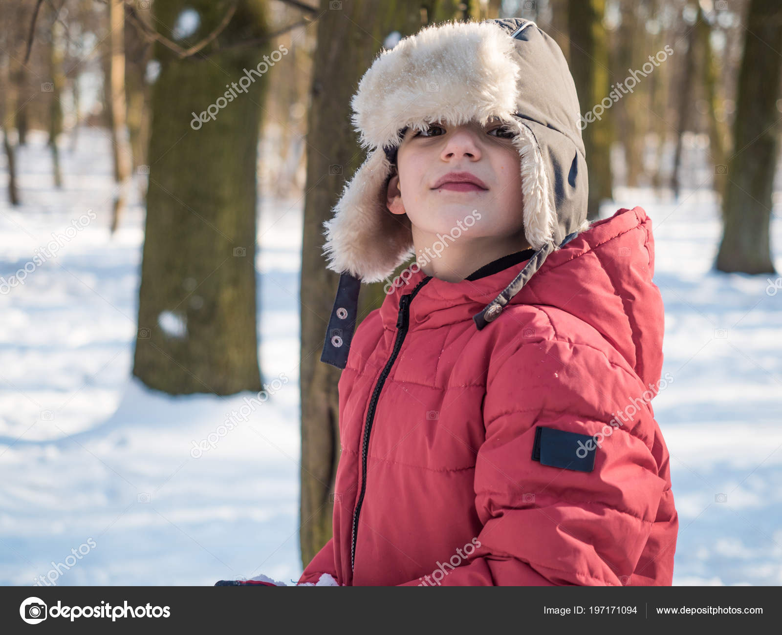 Cute little boy in red jacket at winter park background Stock Photo by ...