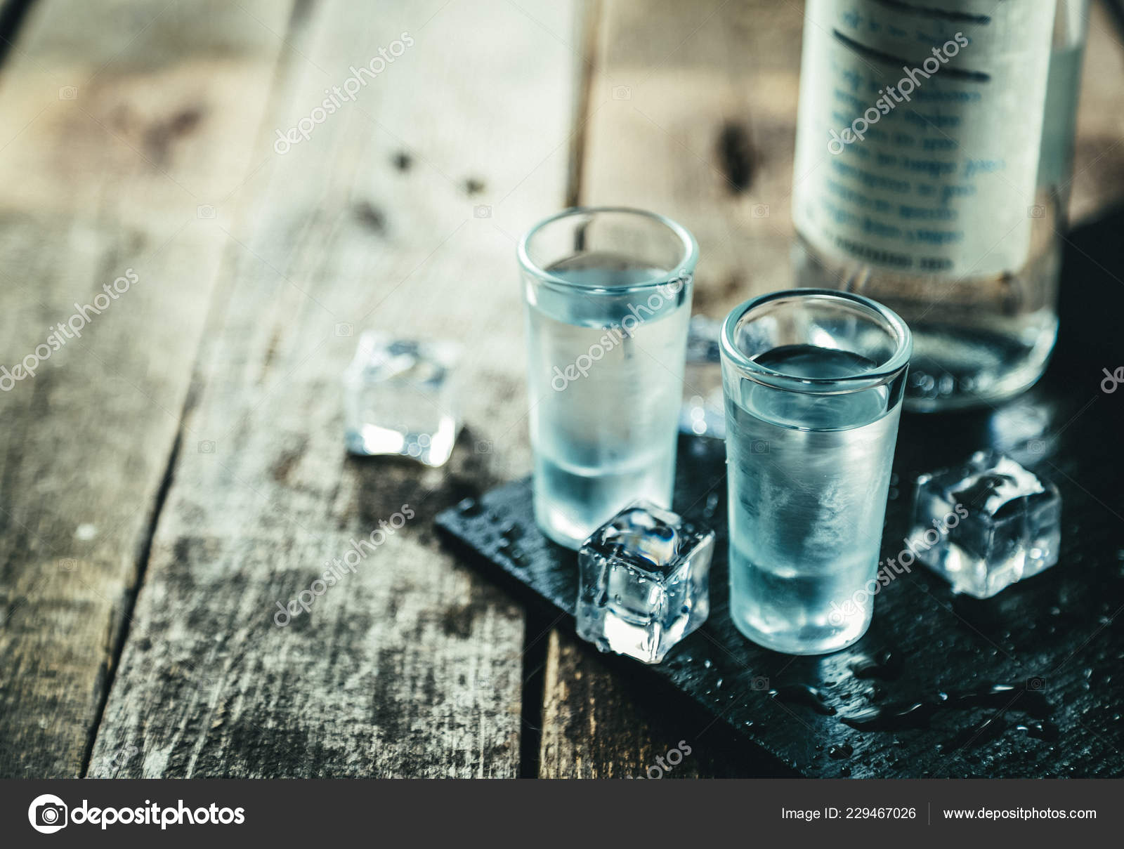 Traditional greek vodka - ouzo in shot glasses Stock Photo by ...