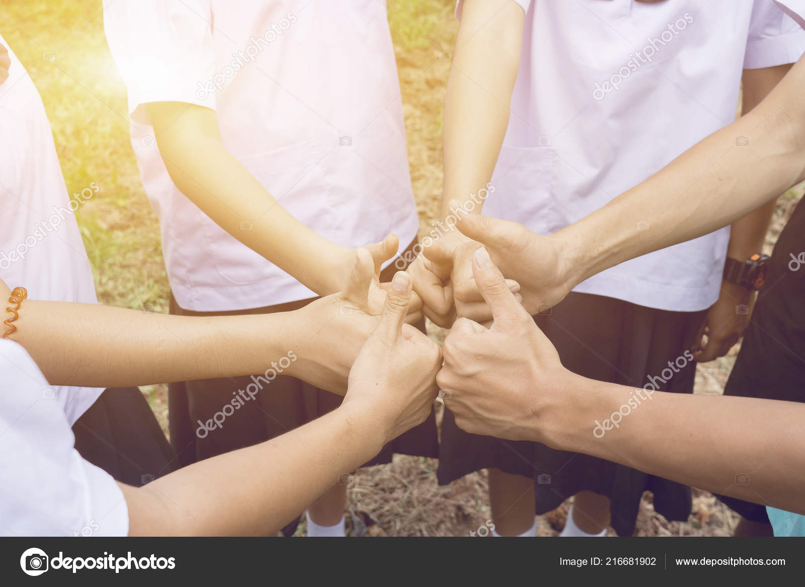 Young People Joining Hands Together Outdoors Sign Good Teamwork Stock ...