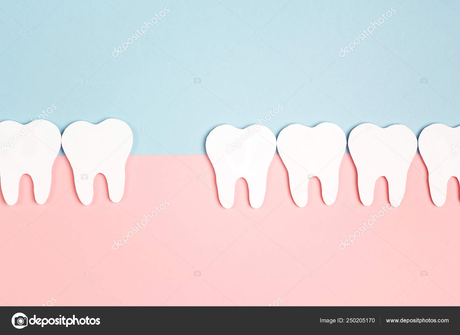 White paper teeth on pink and blue background. Removal and impla ...