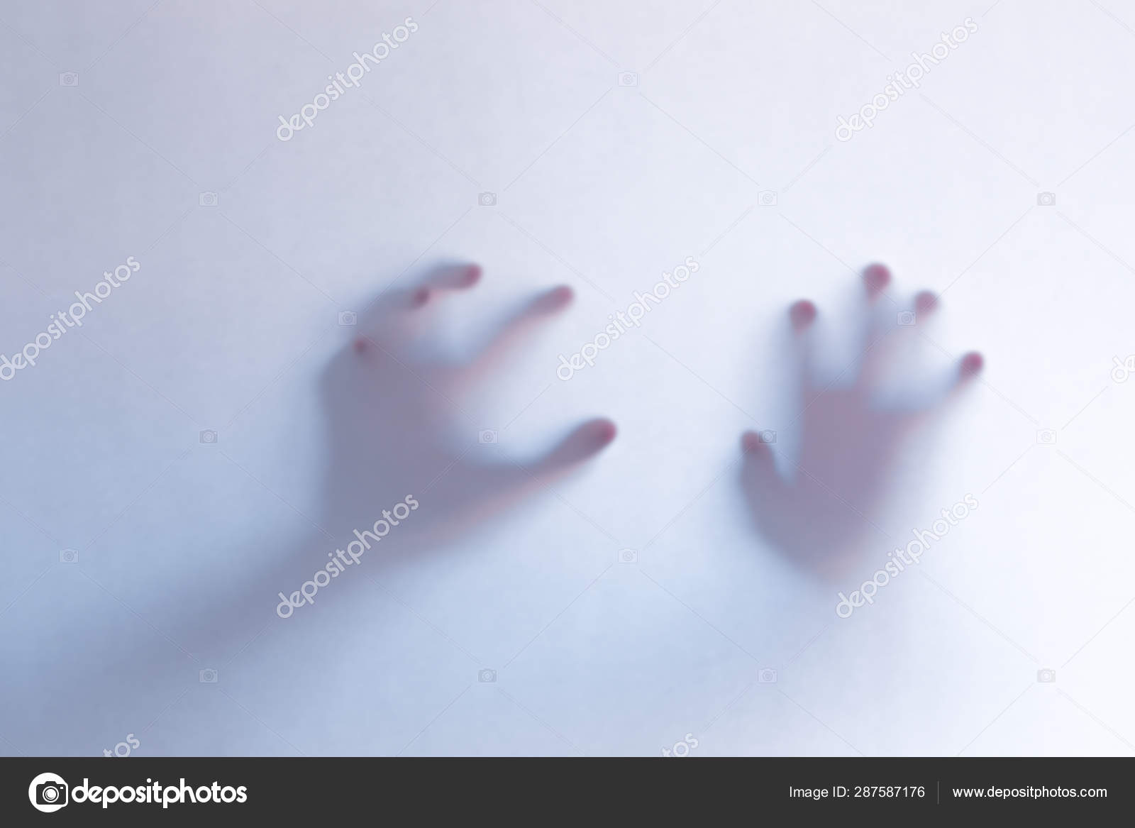 Defocused scary ghost hands behind a white glass background Stock Photo ...