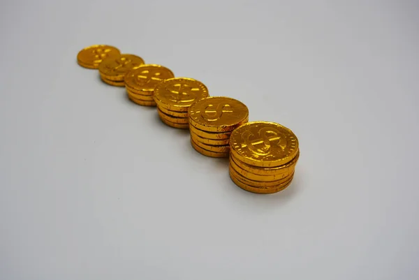 Sweet chocolates are in the form of gold coins. Gold cents with a ...