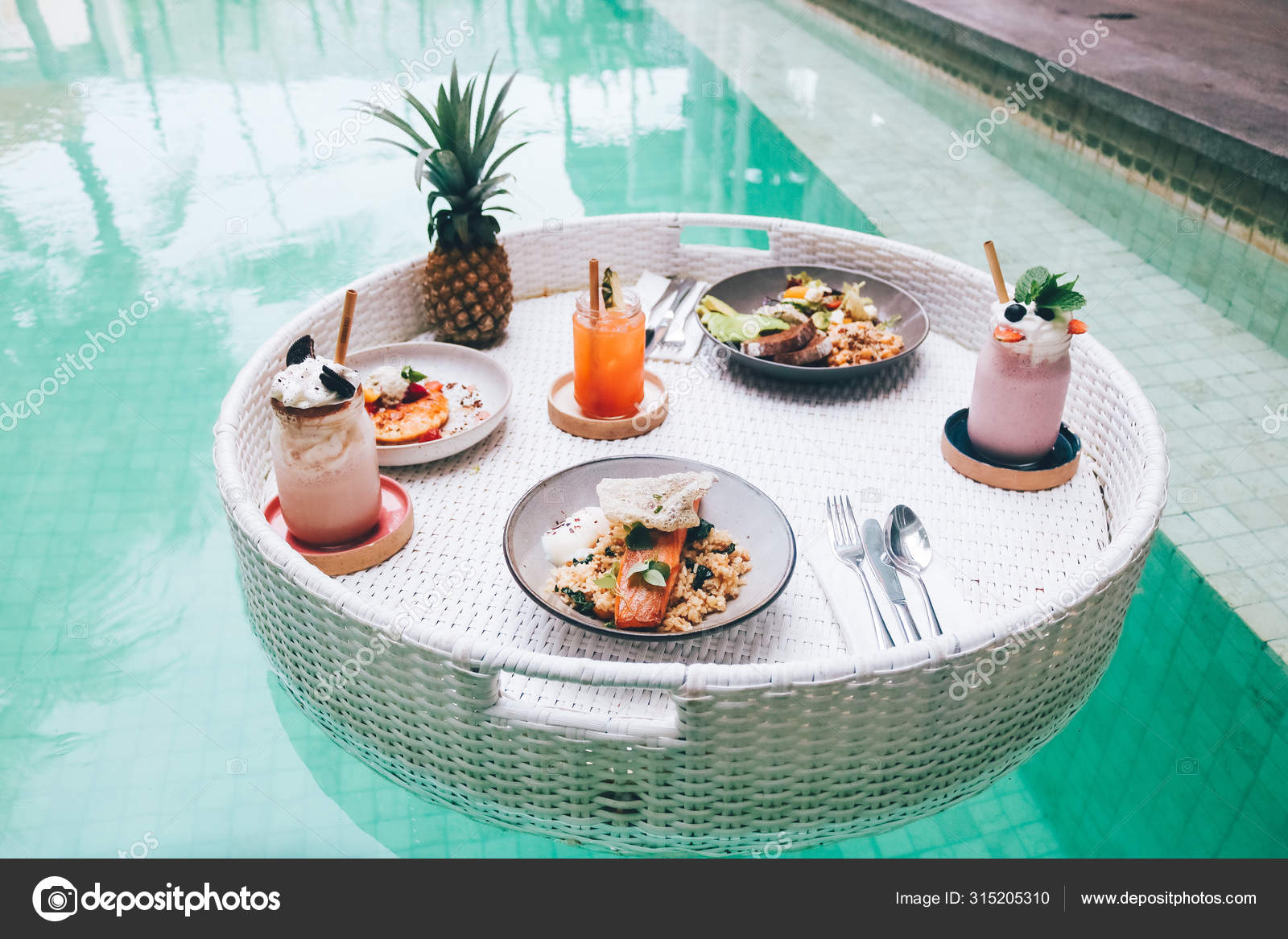 Breakfast on floating table in the pool. Healthy food with smoot Stock ...