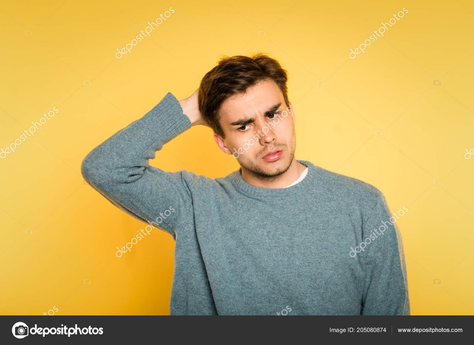 Doubtful uncertain hesitant man scratch expression Stock Photo by ...