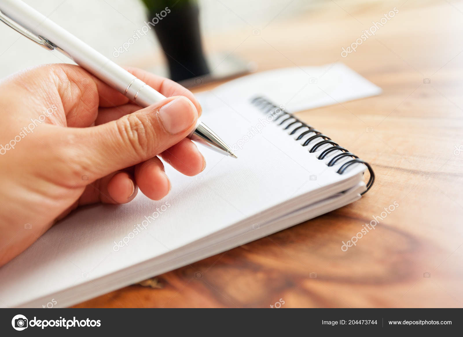 Pencil Writing On Notebook