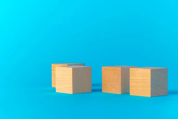 Toy wooden blocks on blue background front view - Stock Image - Everypixel