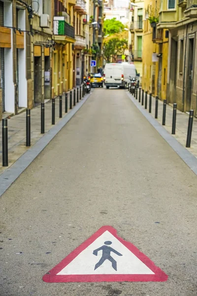 sign, symbol of pedestrian in triangle painted on asphalt road ...