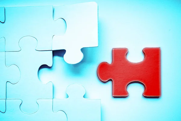 white jigsaw puzzle with one piece missing. Mosaic from puzzles on a ...