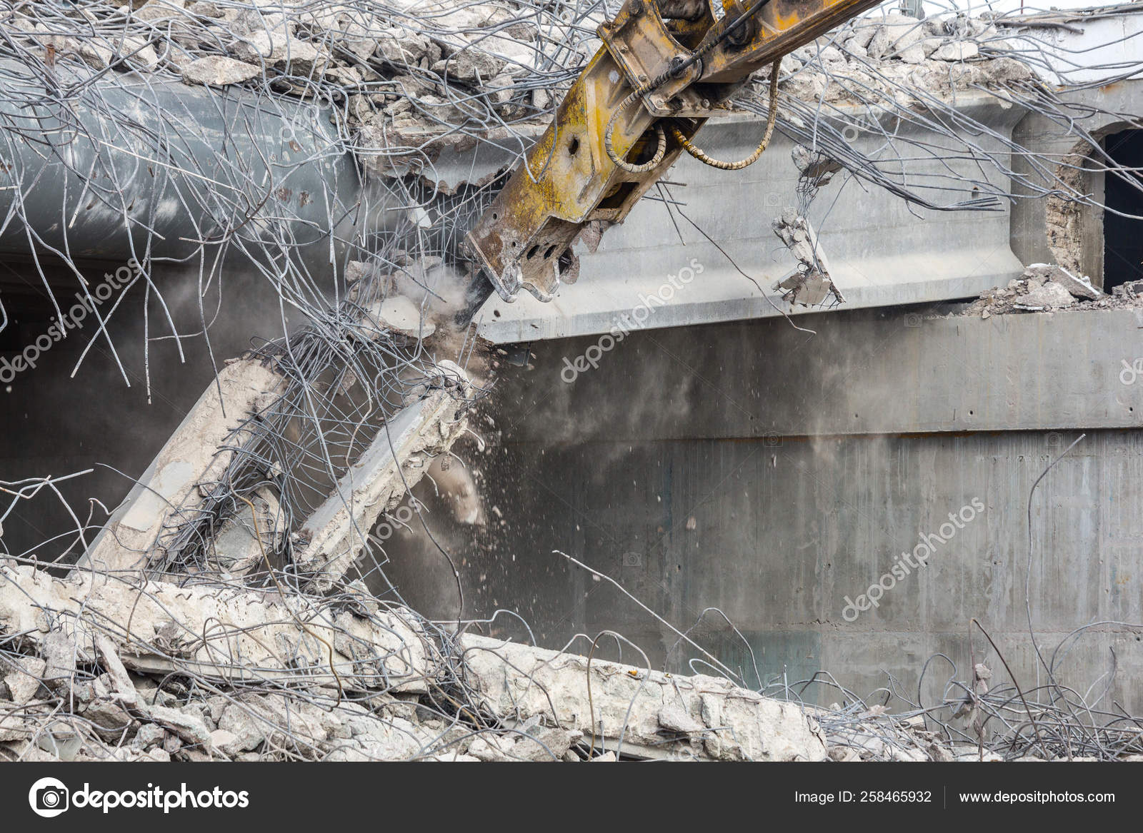 Professional demolition of reinforced concrete structures using Stock ...
