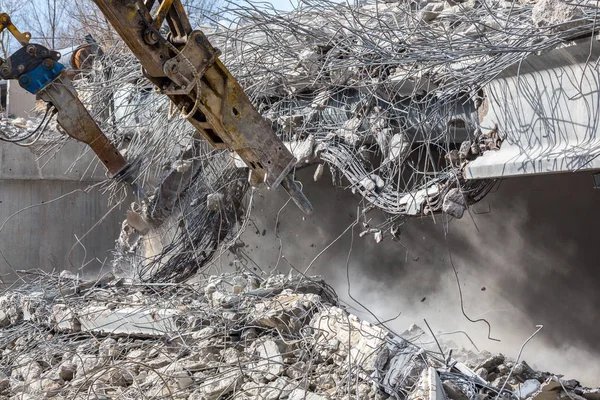 Professional demolition of reinforced concrete structures using Stock ...