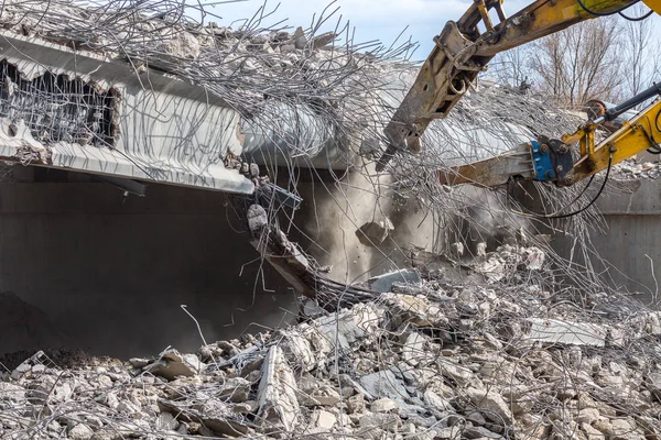 Professional demolition of reinforced concrete structures using Stock ...