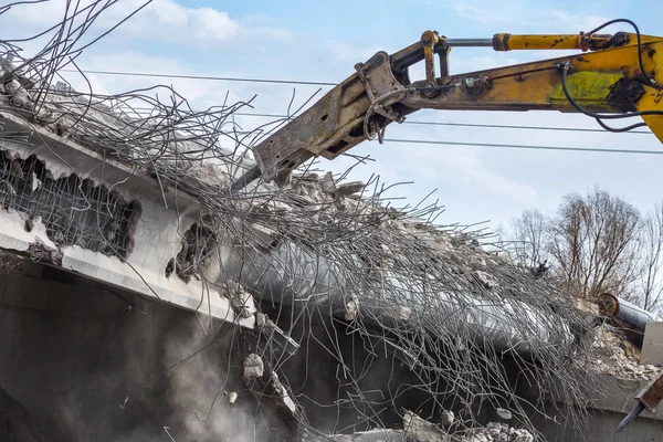 Professional demolition of reinforced concrete structures using Stock ...