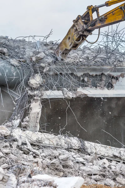 Professional demolition of reinforced concrete structures using Stock ...