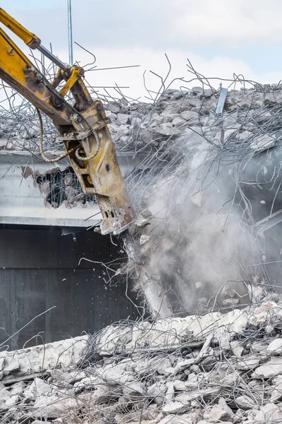 Professional demolition of reinforced concrete structures using Stock ...