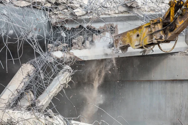 Professional demolition of reinforced concrete structures using Stock ...
