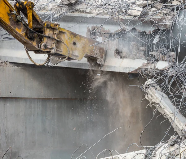 Professional demolition of reinforced concrete structures using Stock ...