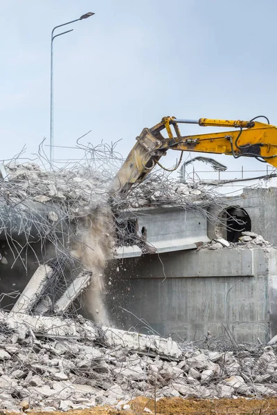 Professional demolition of reinforced concrete structures using Stock ...