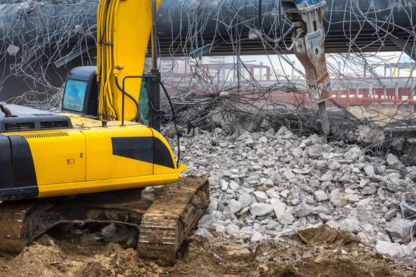 Professional demolition of reinforced concrete structures using Stock ...