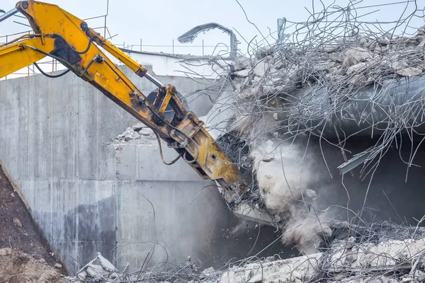Professional demolition of reinforced concrete structures using Stock ...