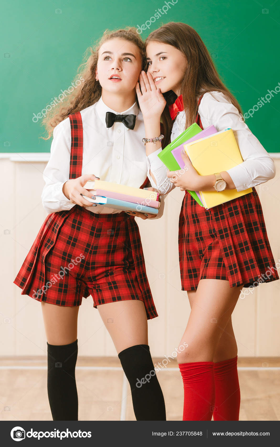 Two Brunette Schoolgirls School Red Uniforms Stand Classroom Books ...