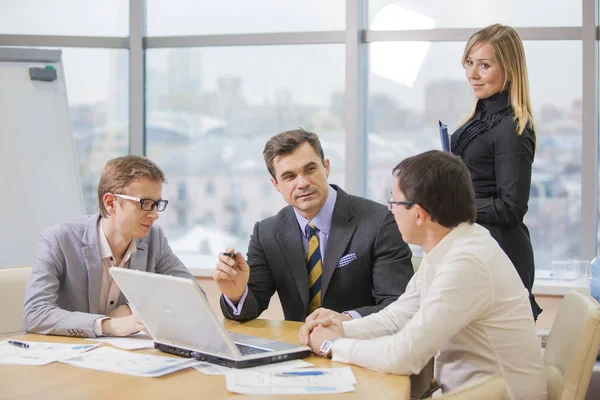Business people discussing working problems in office - Stock Image ...